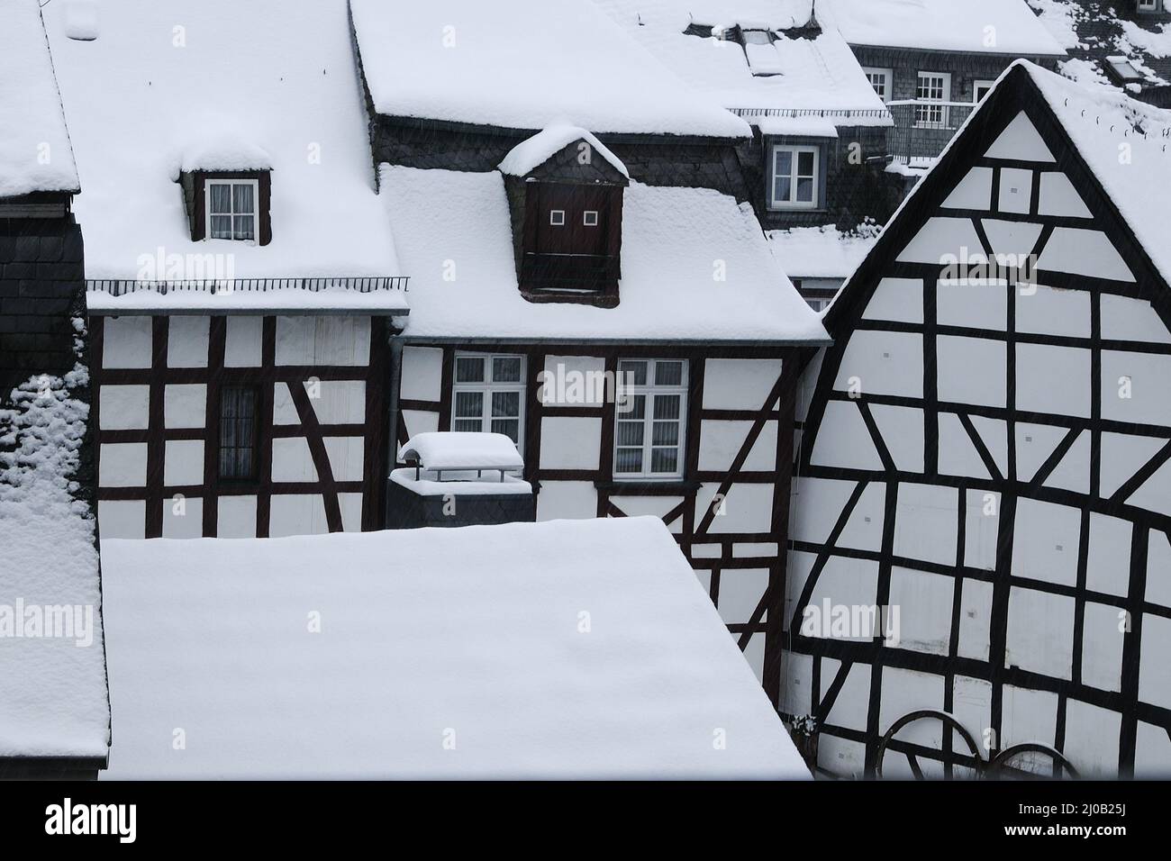 Snow covered half-timber roofs Stock Photo - Alamy