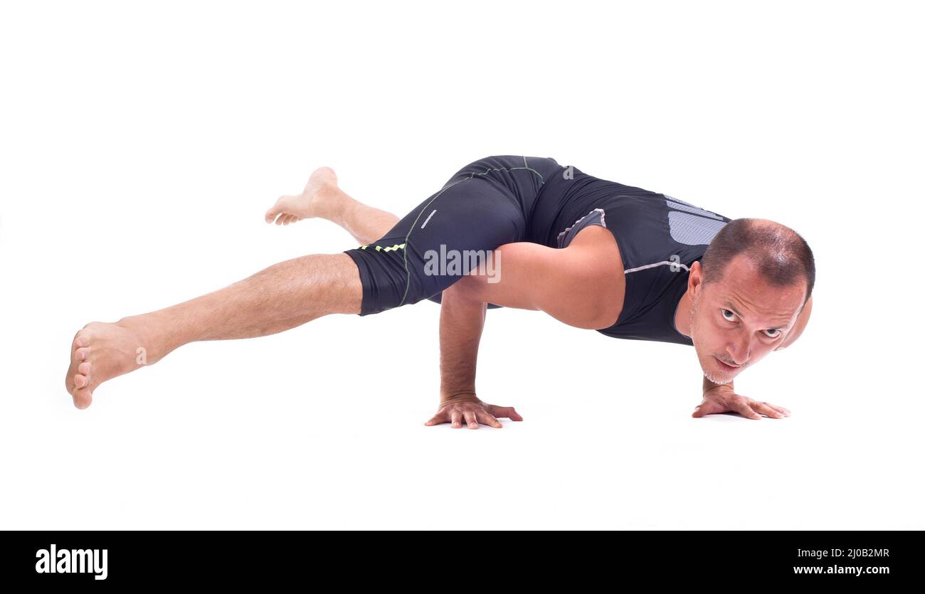 Practicing Yoga exercises: Challenge Pose - Koundiyanasana Stock Photo ...