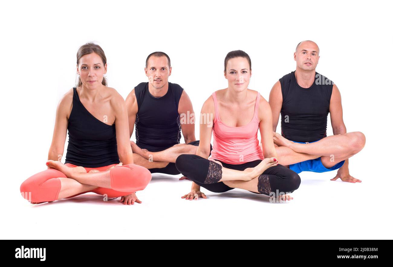 Practicing Yoga exercises in group / Scale Pose - Tolasana Stock Photo ...