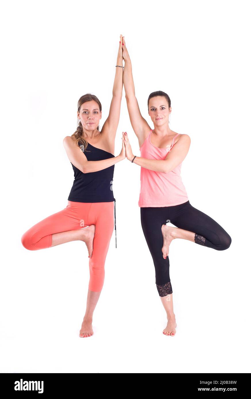 Group practicing tree pose in hi-res stock photography and images - Alamy