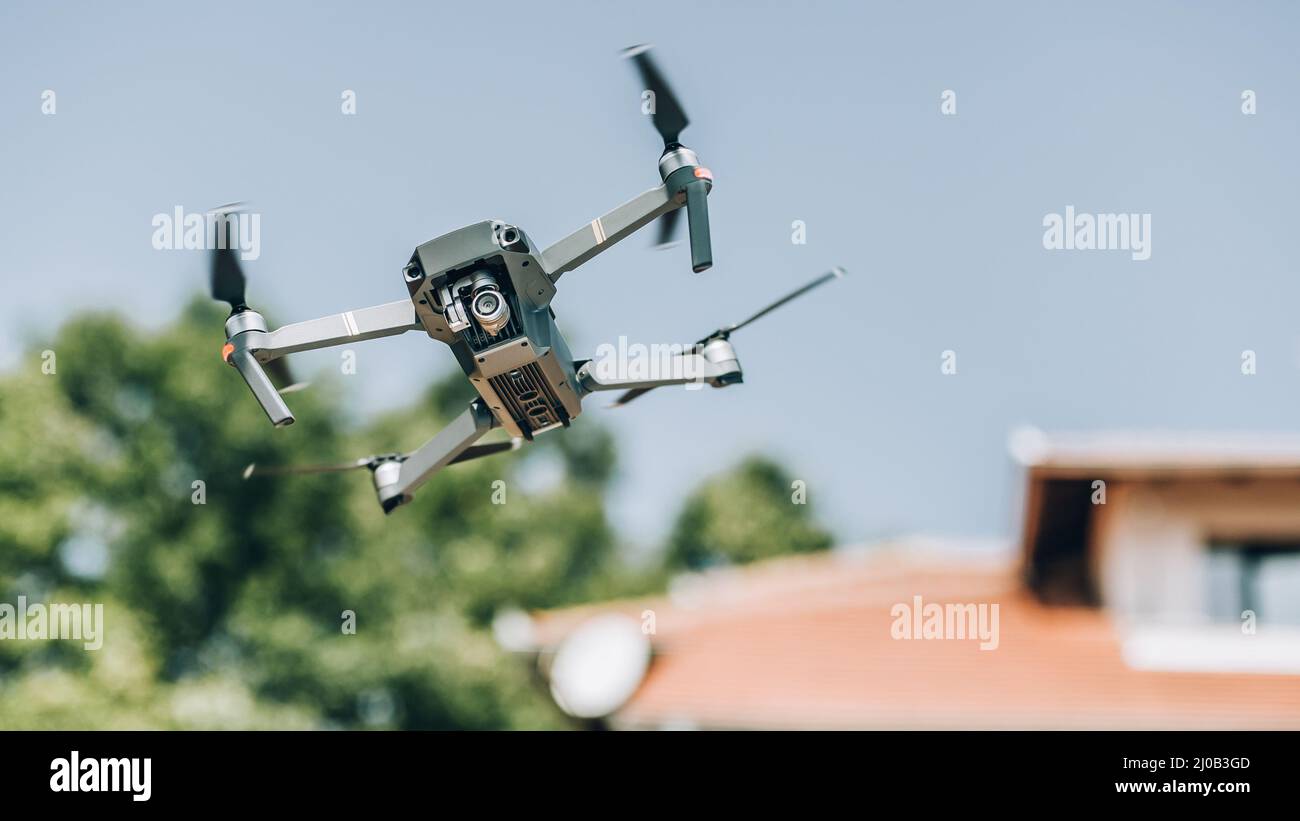 Uav drone copter flying with high resolution digital camera. Close up ...