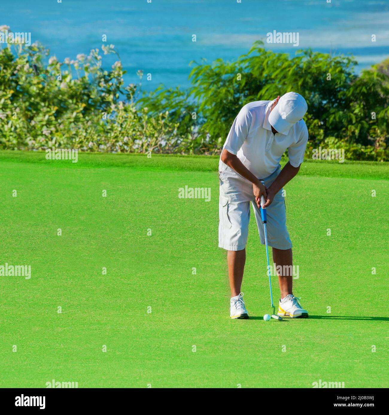 Golf club. Man playing golf Stock Photo - Alamy
