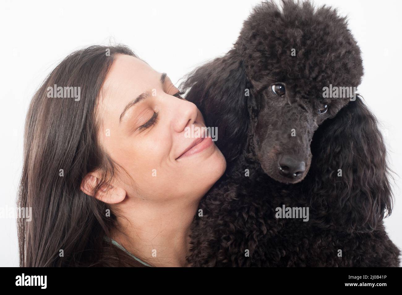 Portrait of a beautiful young woman hugging her beautiful dog. Big ...