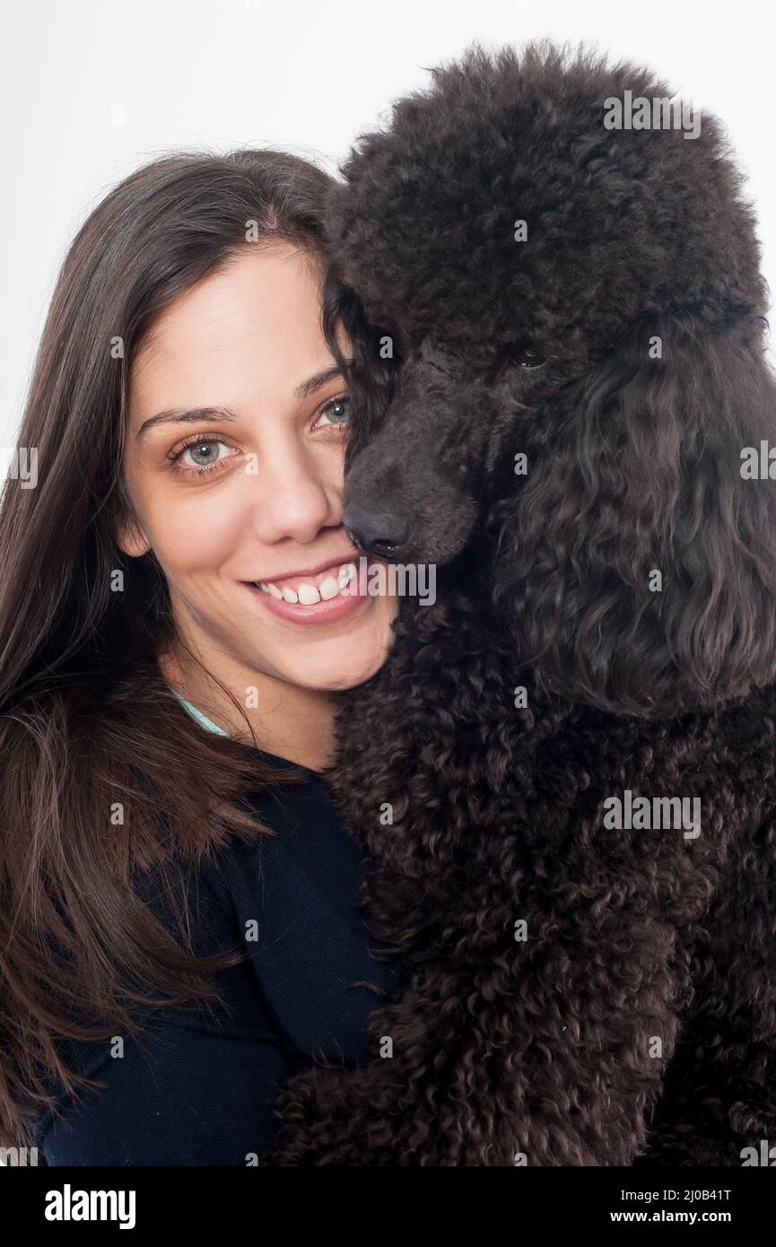 Portrait of a beautiful young woman hugging her beautiful dog. Big ...