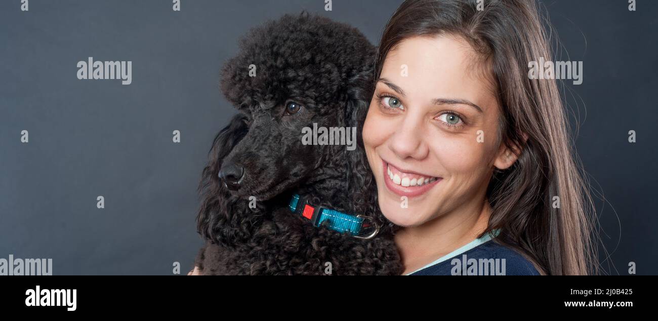 Portrait of a beautiful young woman hugging her beautiful dog. Big ...