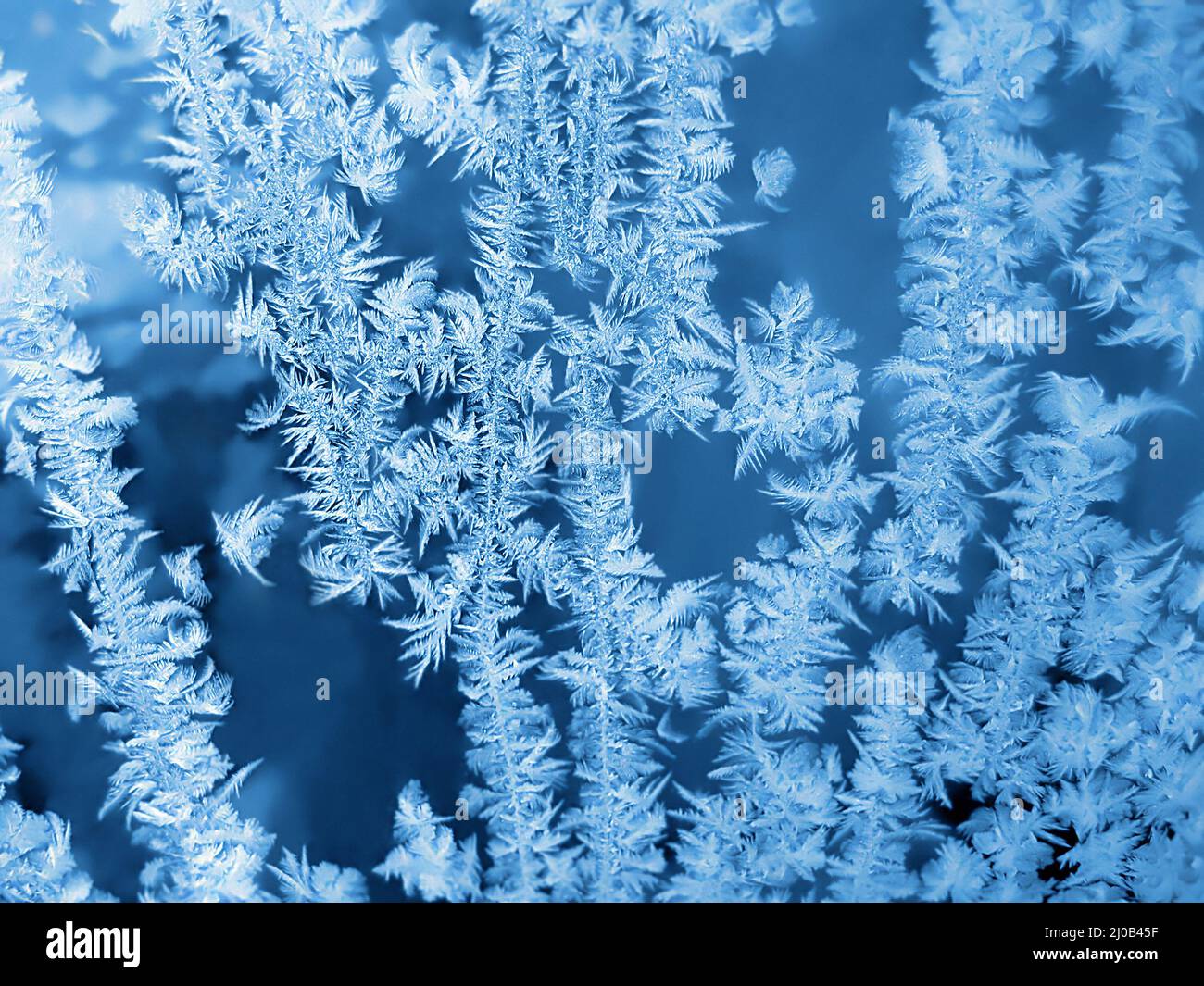 Ice pattern on winter glass Stock Photo - Alamy