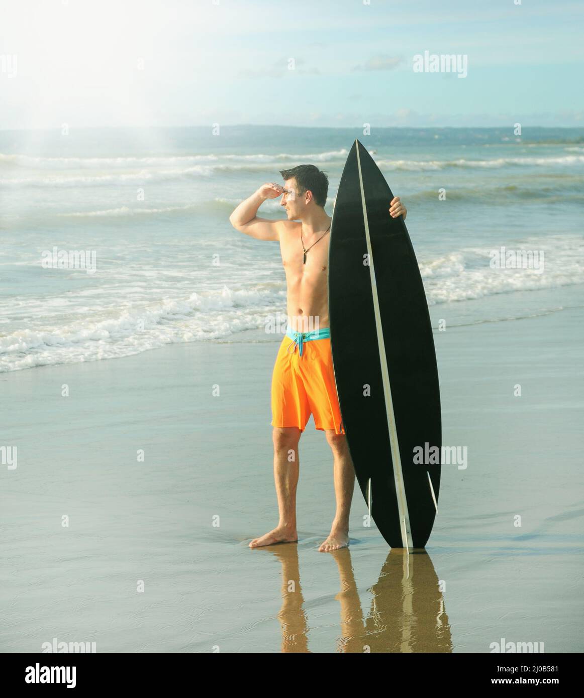 Surfer with board Stock Photo - Alamy