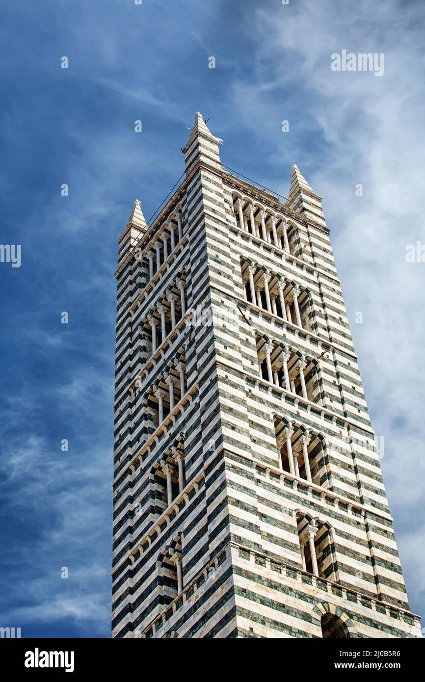 The main cathedral (duomo) in Siena Italy, with high striped tower ...