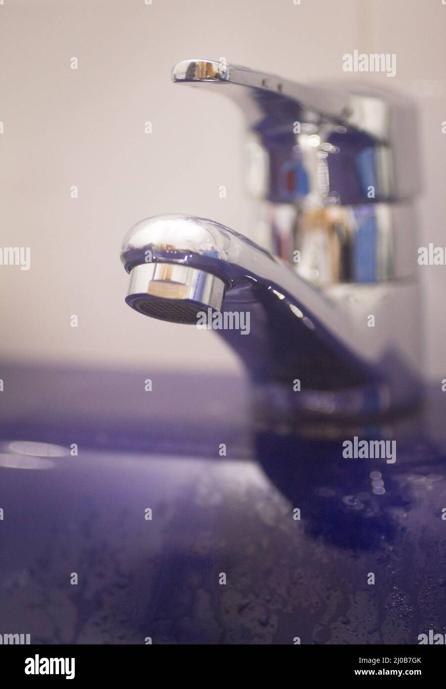 Domestic bathroom wash basin tap close-up Stock Photo - Alamy