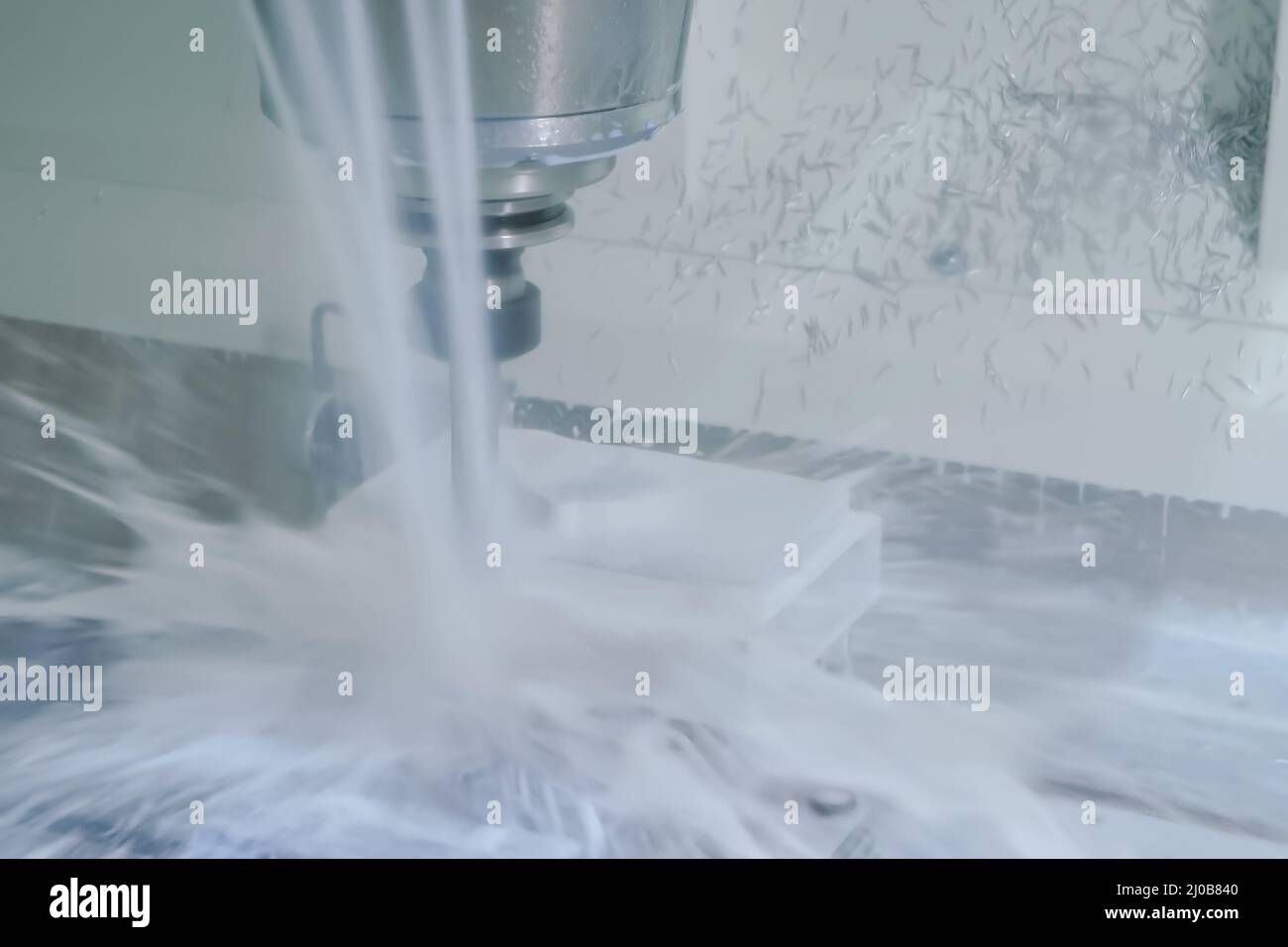 Turning milling machine with cooling system cutting metal workpiece at ...