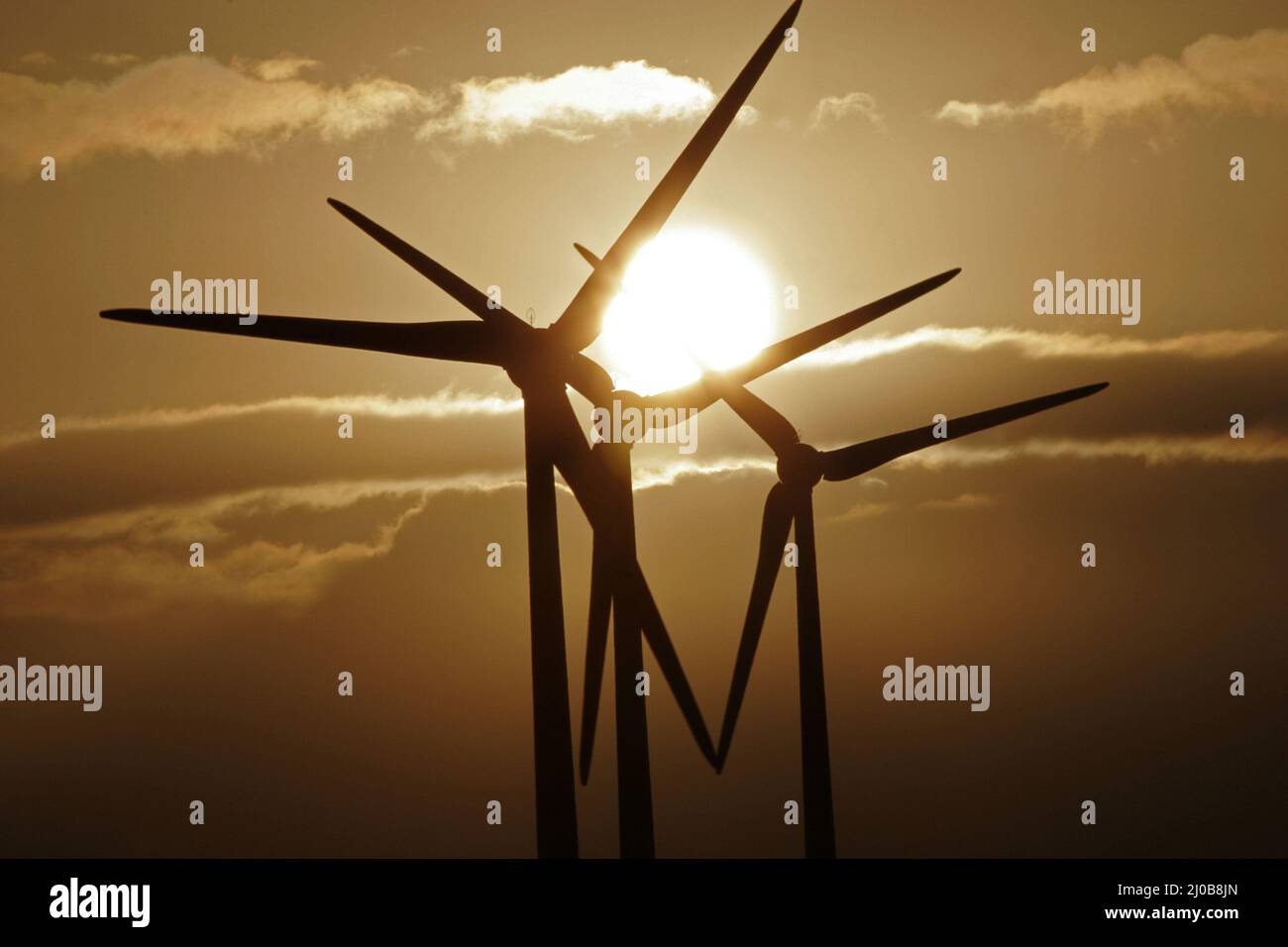 Wind turbines and sun Stock Photo - Alamy