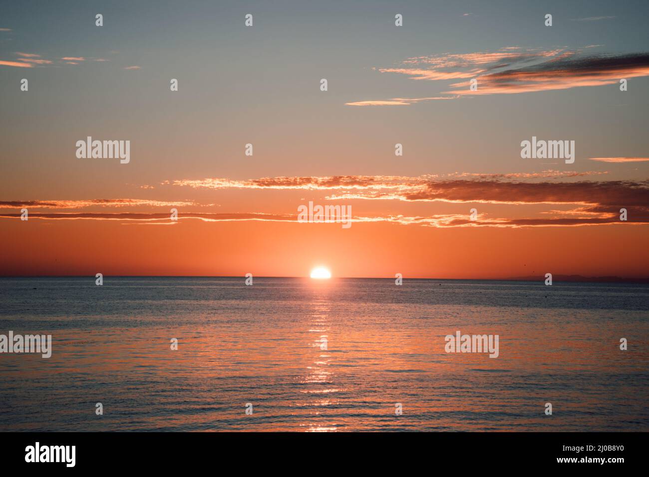 Photo of evening sky going under the ocean Stock Photo - Alamy