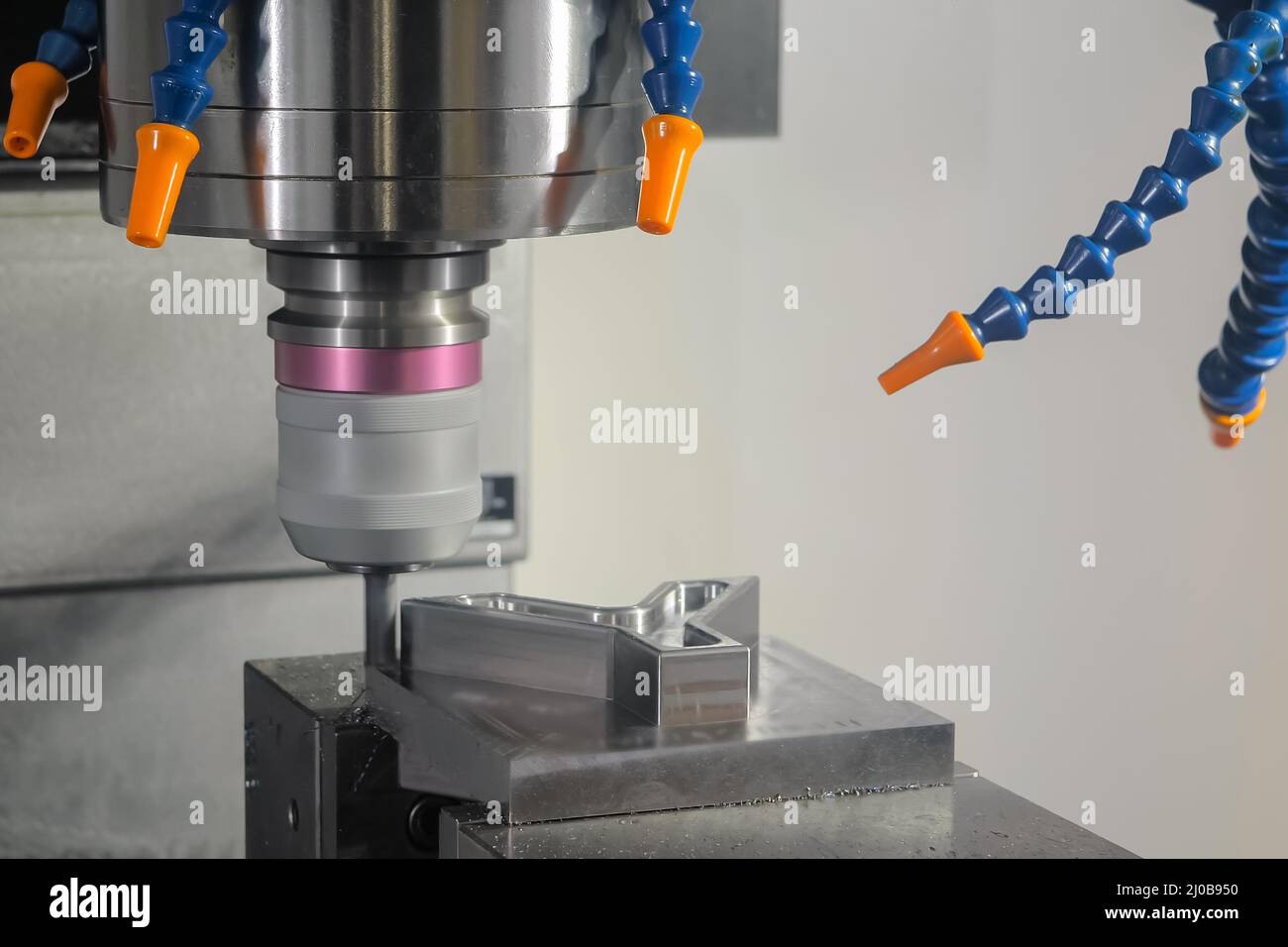 Automatic turning milling machine cutting metal workpiece at factory ...