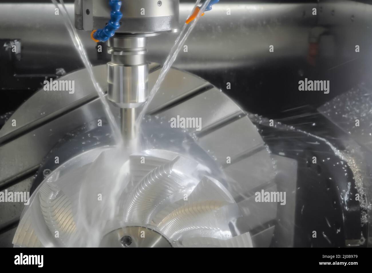 Turning milling machine with cooling system cutting metal workpiece at ...