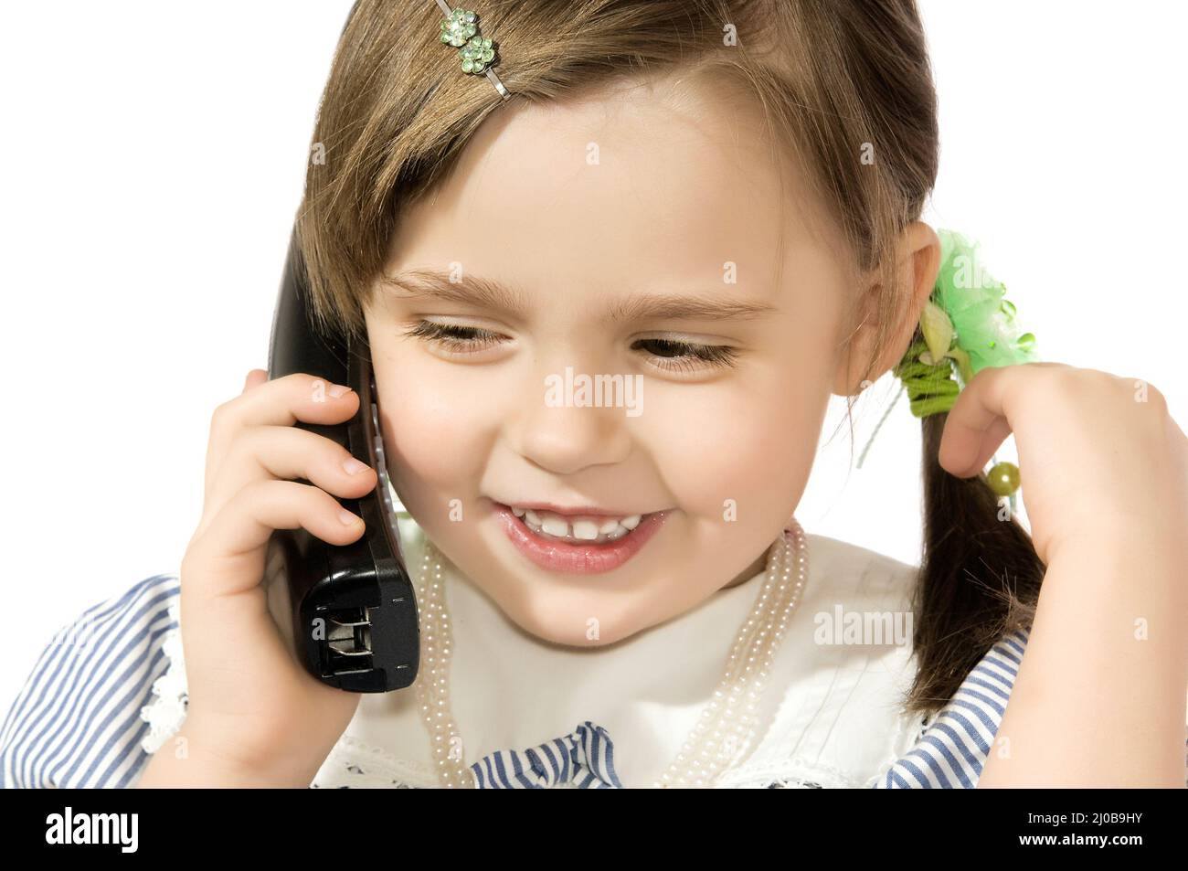 Little girl with phone Stock Photo - Alamy