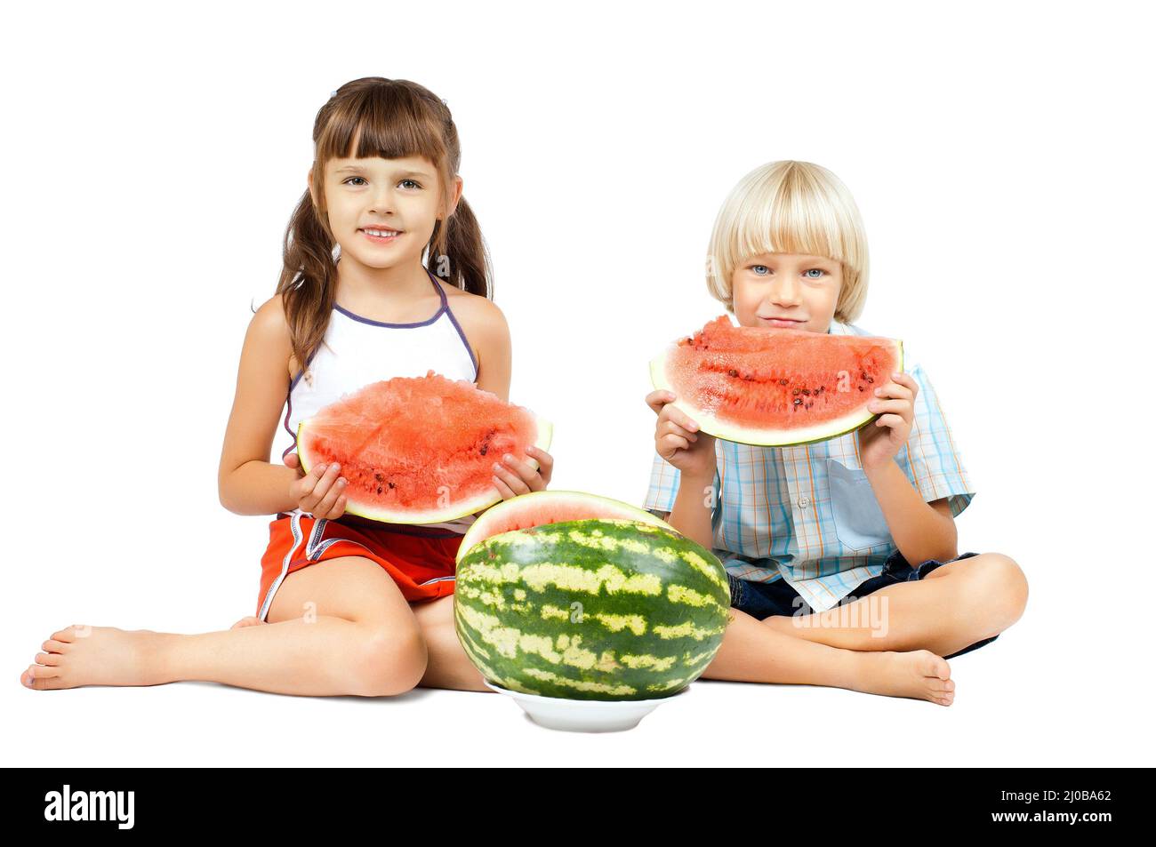 Happy children eating Cut Out Stock Images & Pictures - Alamy