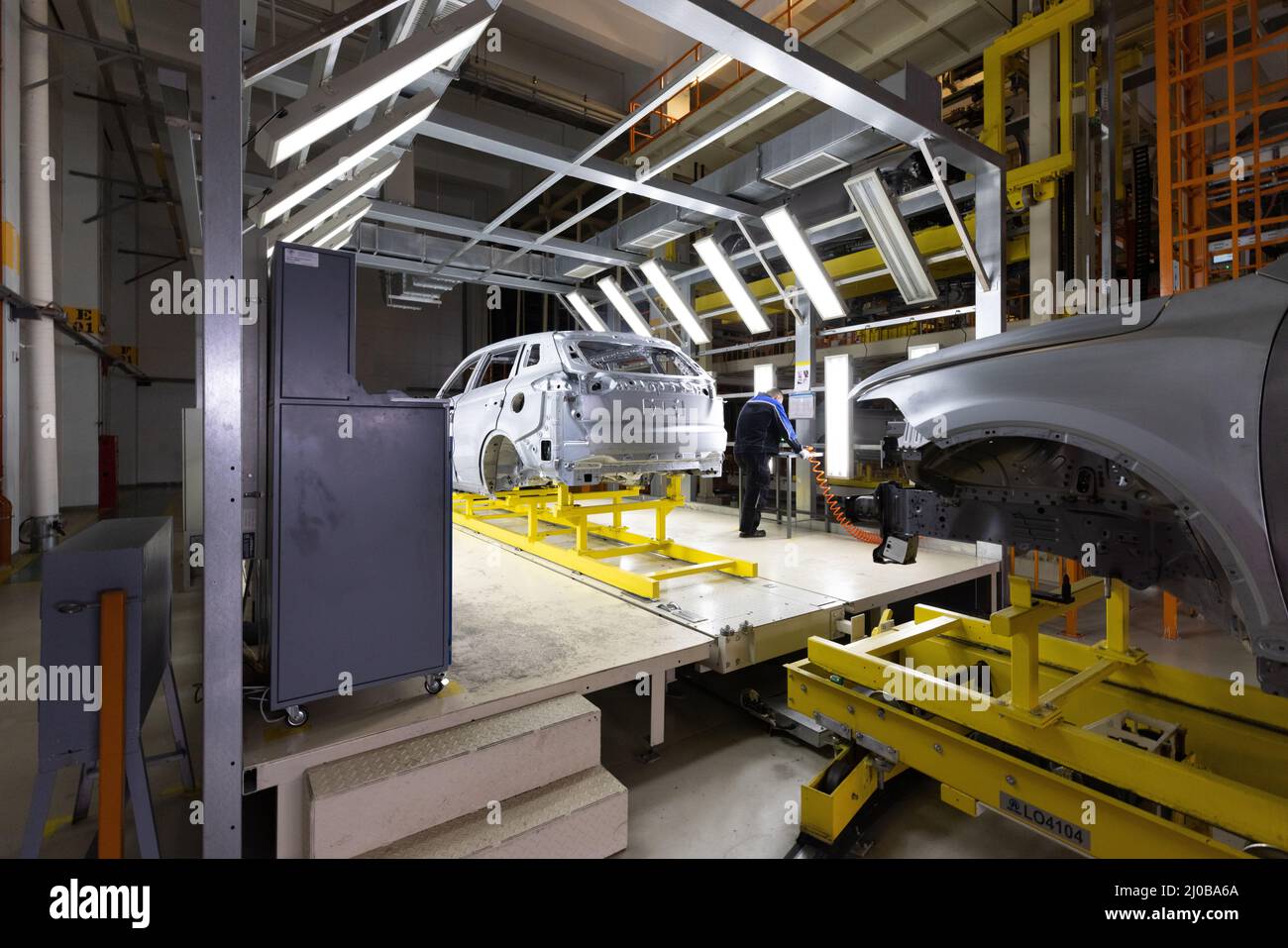 Car bodies are on assembly line. Factory for production of cars. Modern ...