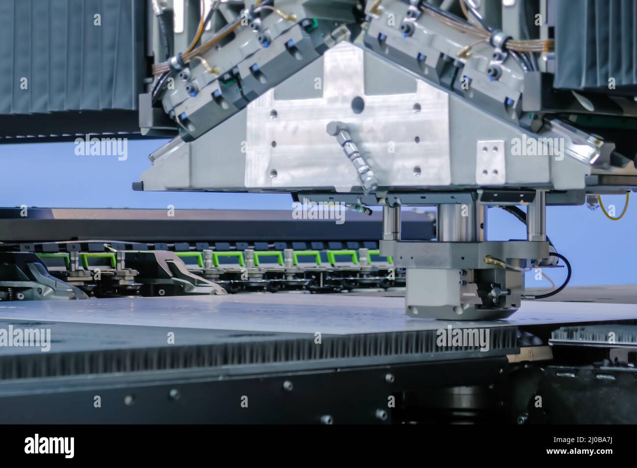 Automatic punching and shearing machine working with sheet metal at ...