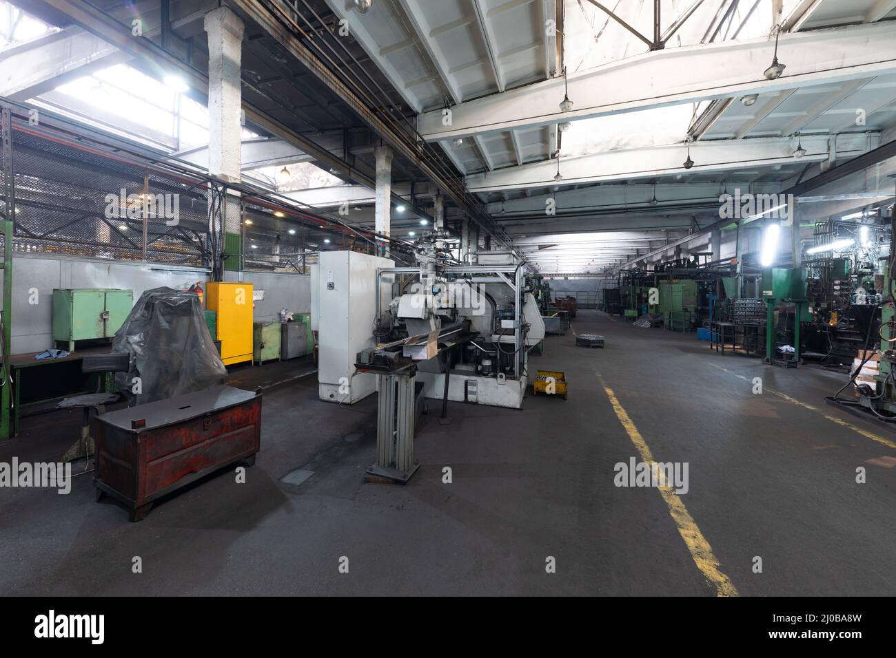 The interior of a big industrial building of factory with steel ...