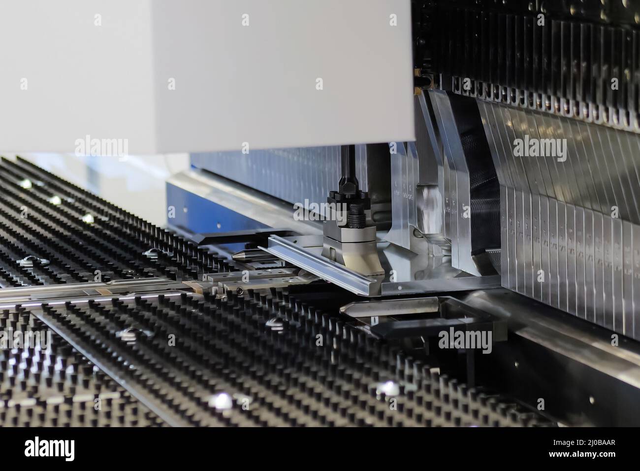 Automatic hydraulic bending machine working with sheet metal at factory ...