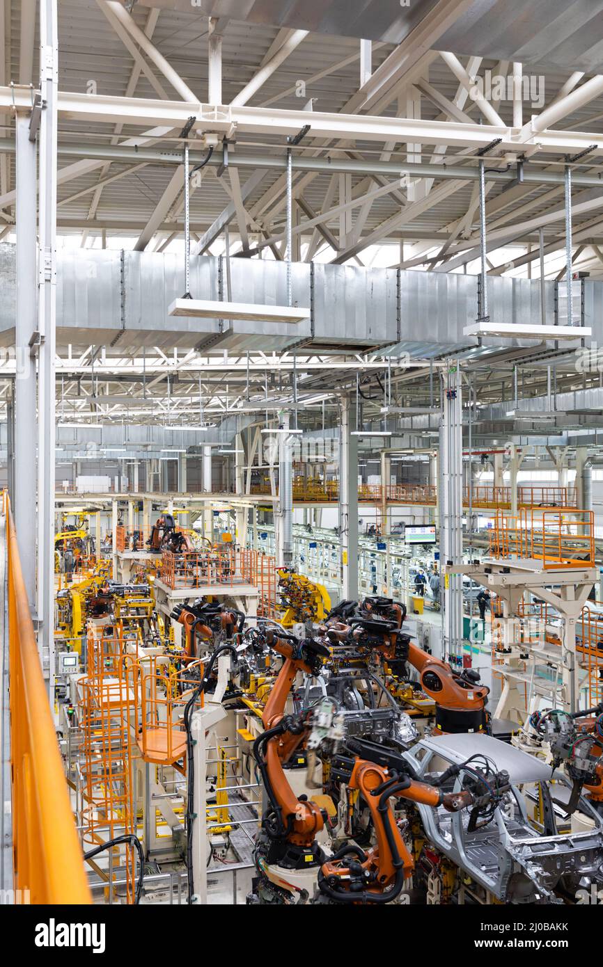 Vertical photo of automobile production line. Modern car assembly plant ...