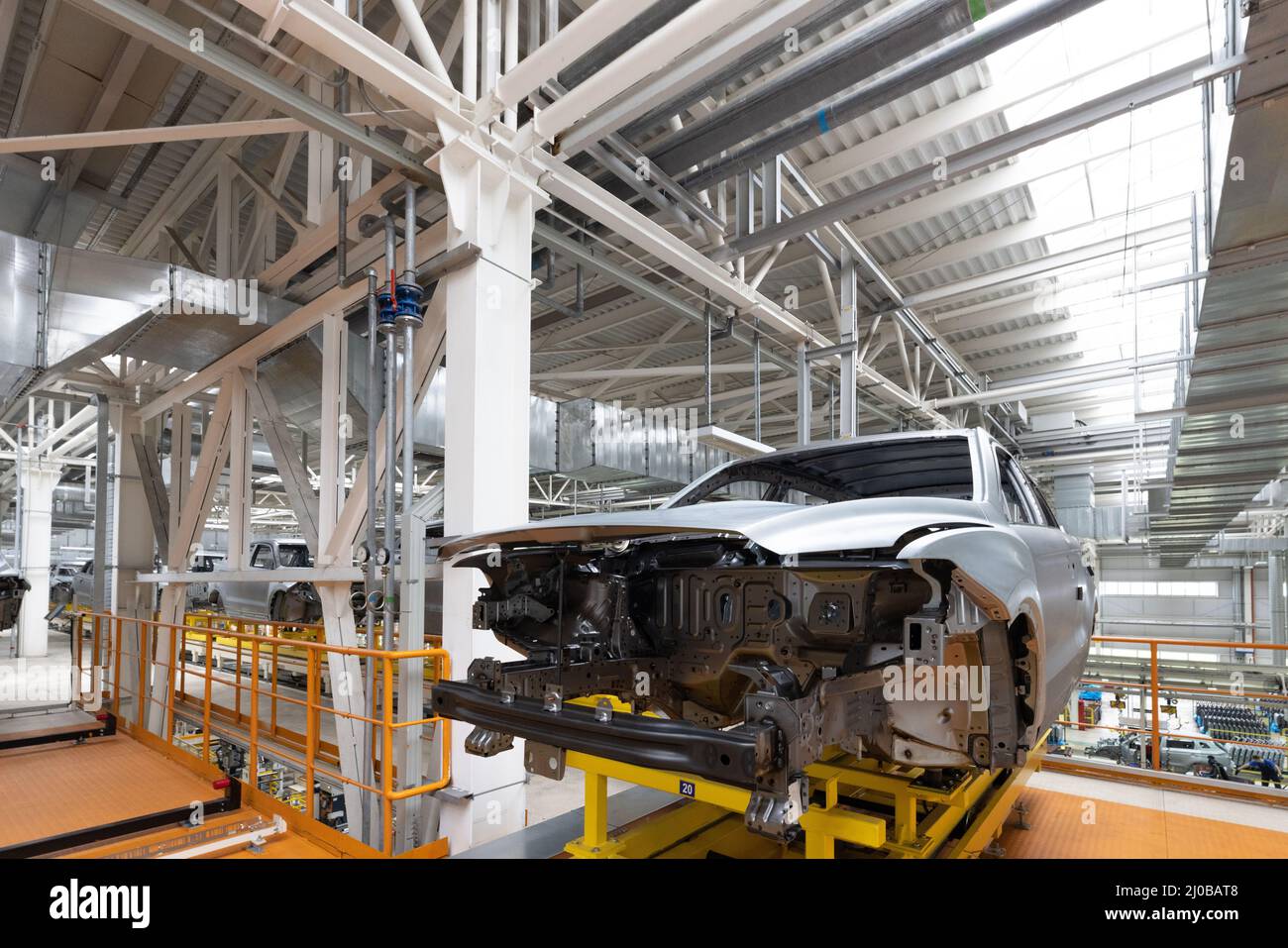 Car bodies are on assembly line. Factory for production of cars. Modern ...