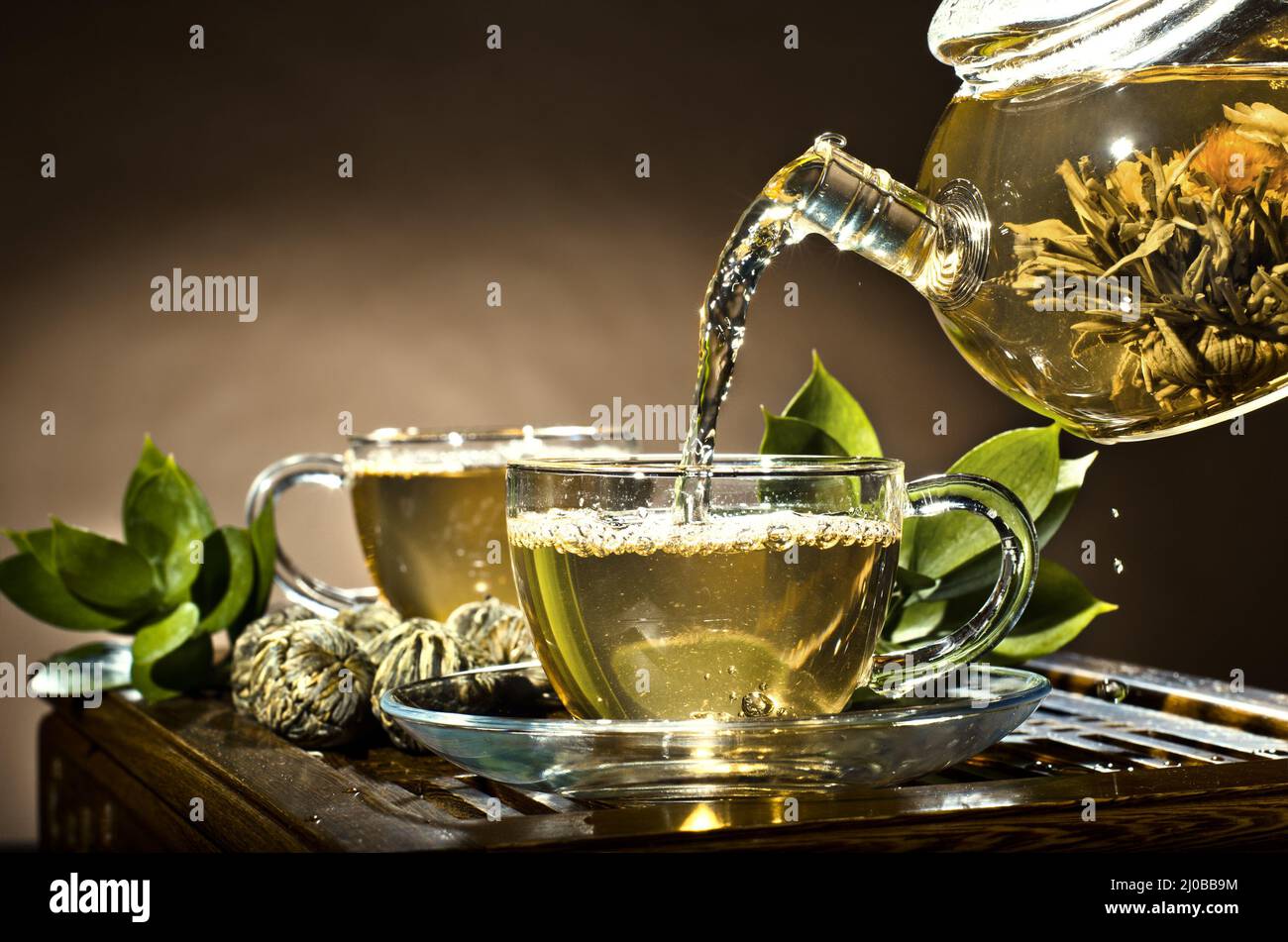 Teapot pouring out tea hi-res stock photography and images - Alamy