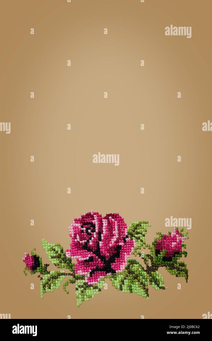 Cross embroidered rose on beige background Stock Photo - Alamy