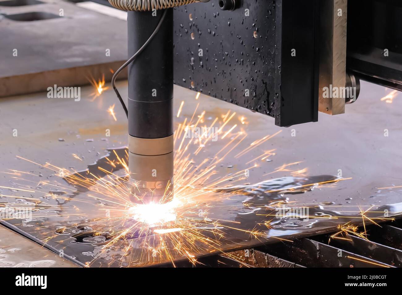 Plasma cutting machine working with sheet metal with sparks Stock Photo ...