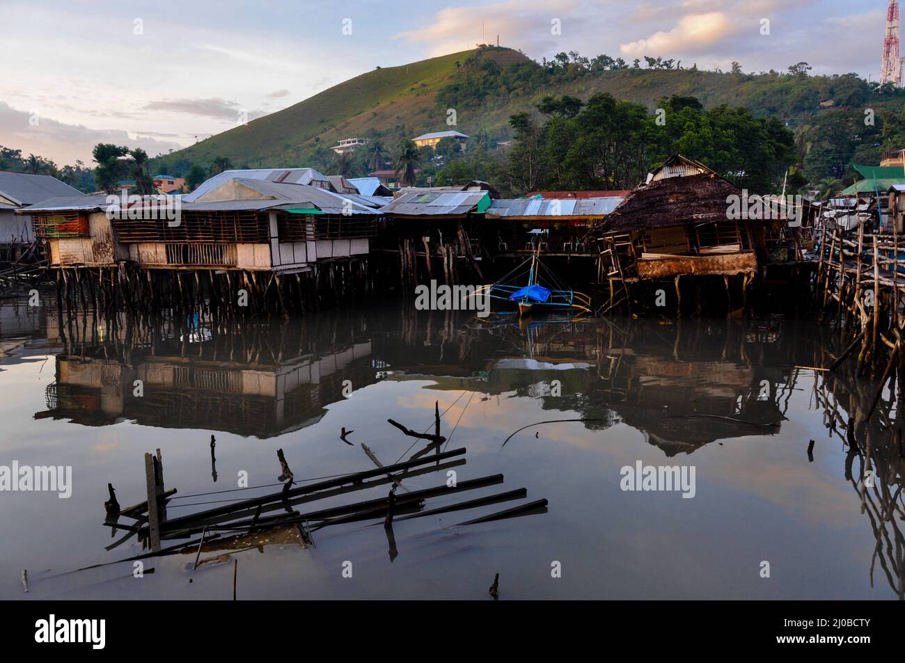 Small Nipa Homes and a Broken Raft on The Black Water Stock Photo - Alamy