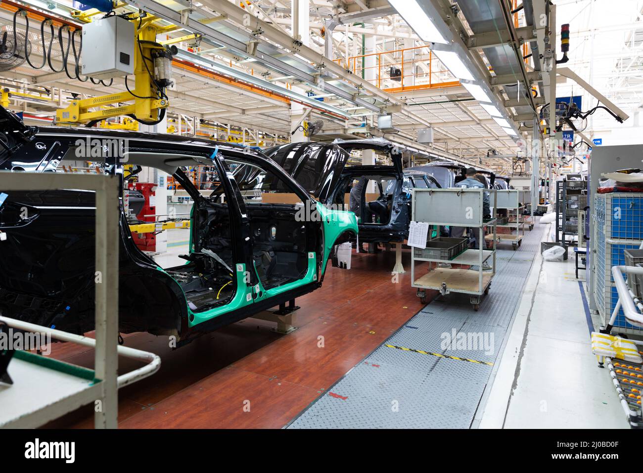 Photo of automobile production line. Welding car body. Modern car ...
