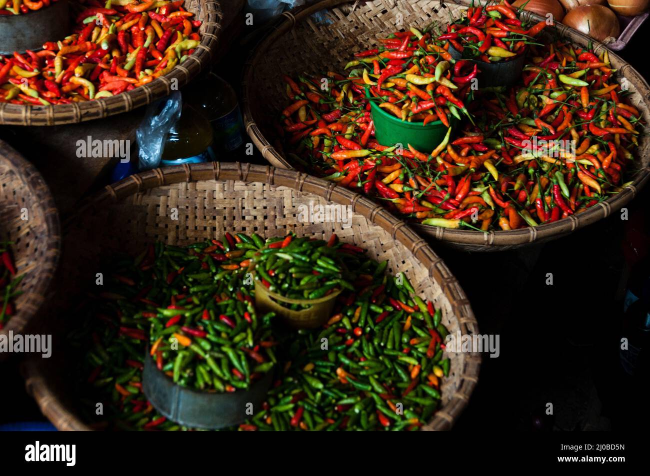 Small Green and Red Chillies at a local Market Stock Photo - Alamy