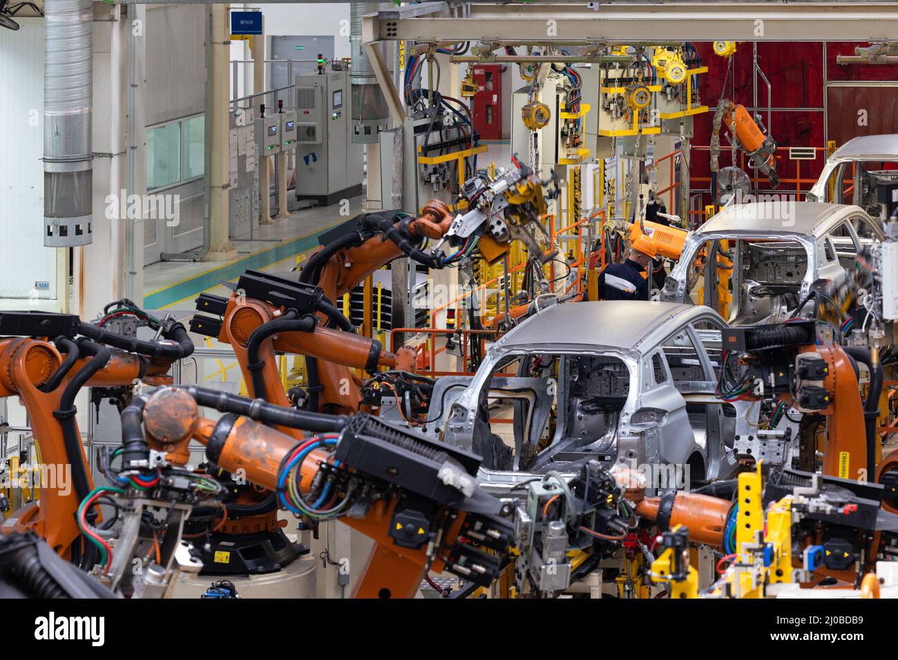 Photo of automobile production line. Modern car assembly plant. Modern ...