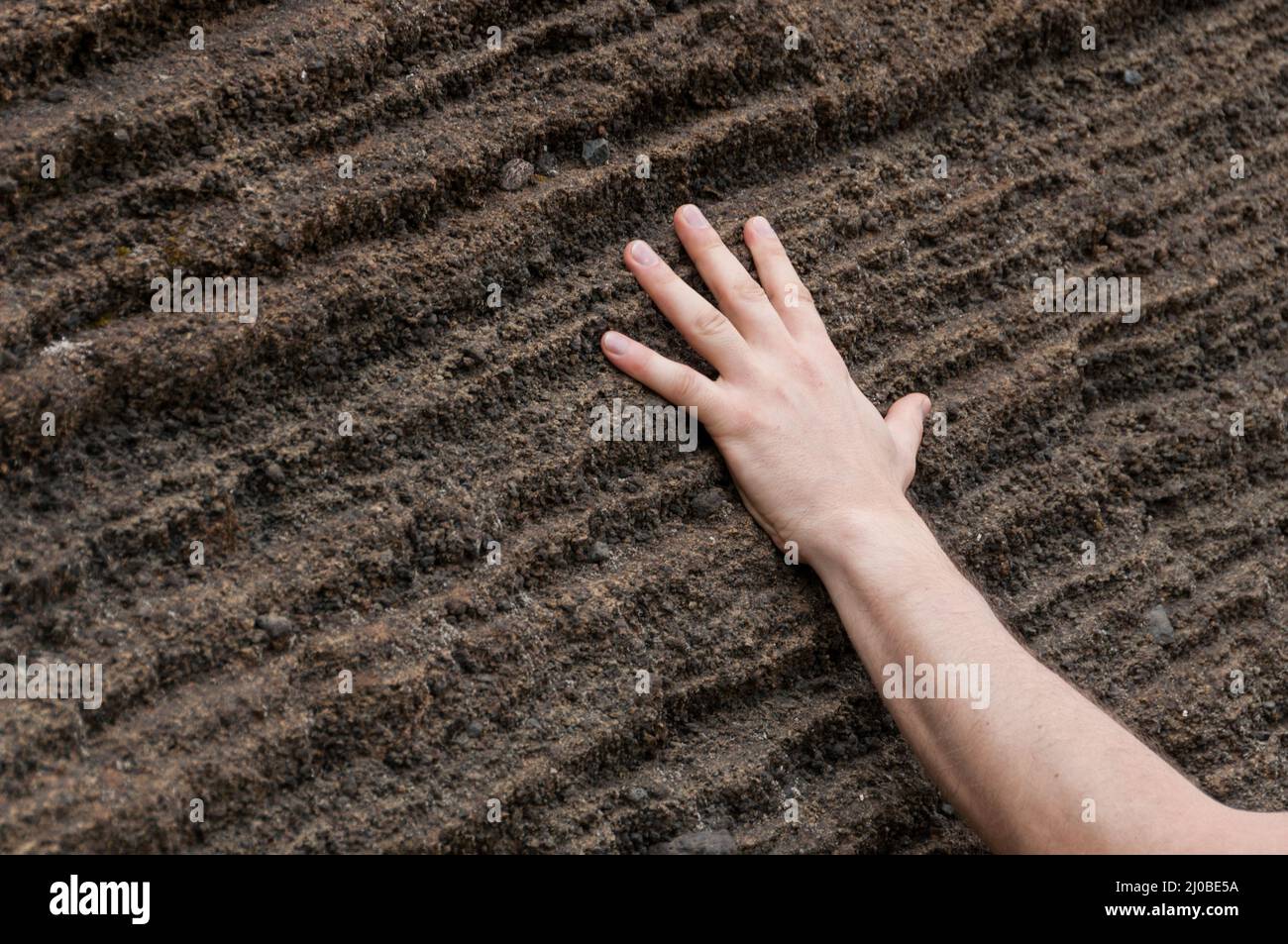 Hand on Geological sandstone rock formation in cape verde Stock Photo ...