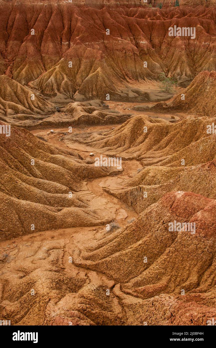 Dry valley red orange sand stone rock formation in hot desert of ...