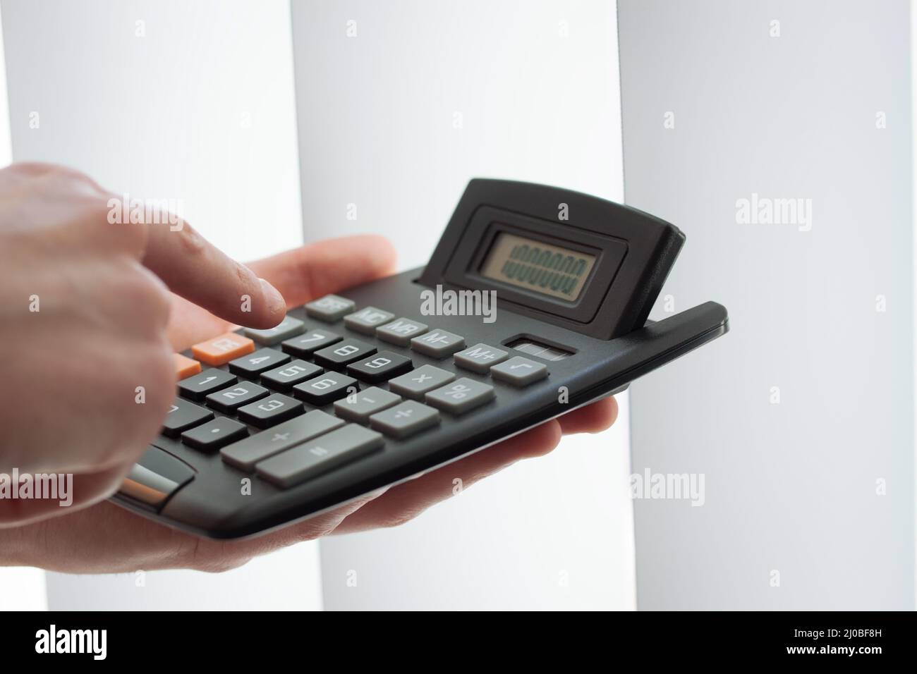 Businessman calculator hi-res stock photography and images - Alamy