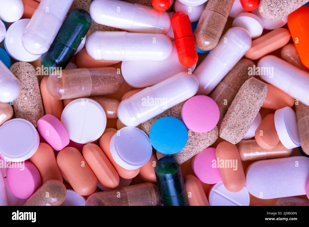 Medicine pills and capsules background. Top view Stock Photo - Alamy