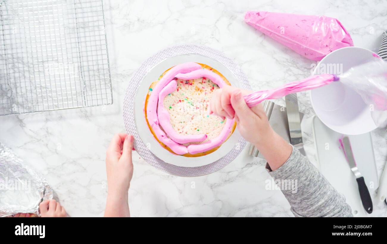 Frosting round funfetti cake layers hi-res stock photography and images ...