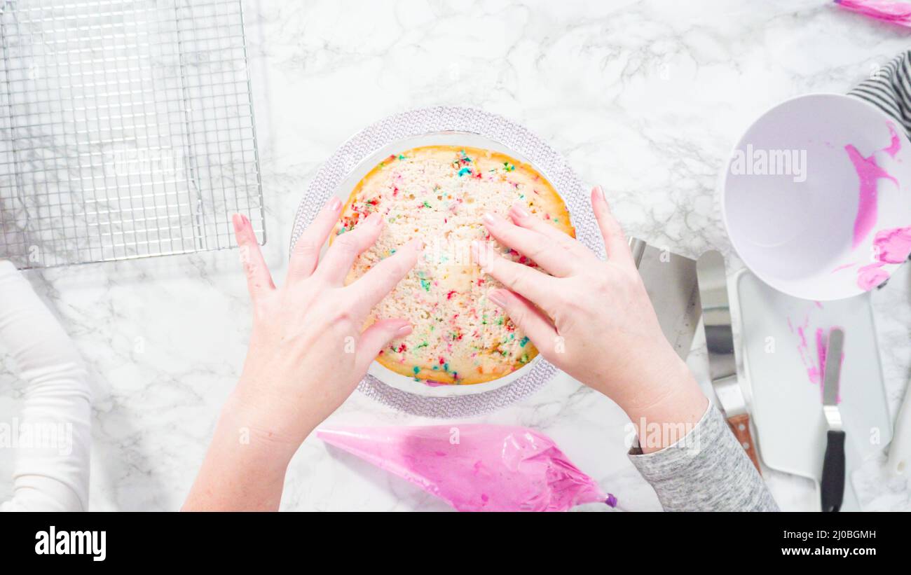 Frosting round funfetti cake layers hi-res stock photography and images ...