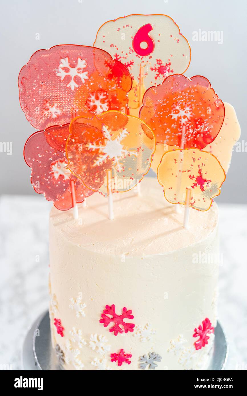 Tall round cake with Italian buttercream frosting decorated with ...