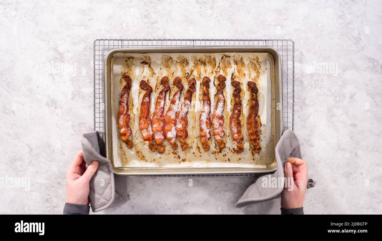 Flat lay. Step by step. Cooked bacon strips on a baking sheet with ...