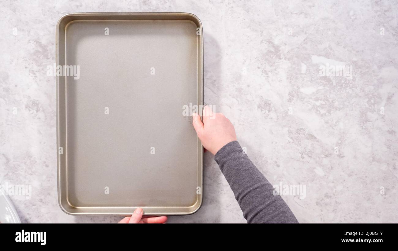 Flat lay. Step by step. Empty baking sheets with a white parchment ...
