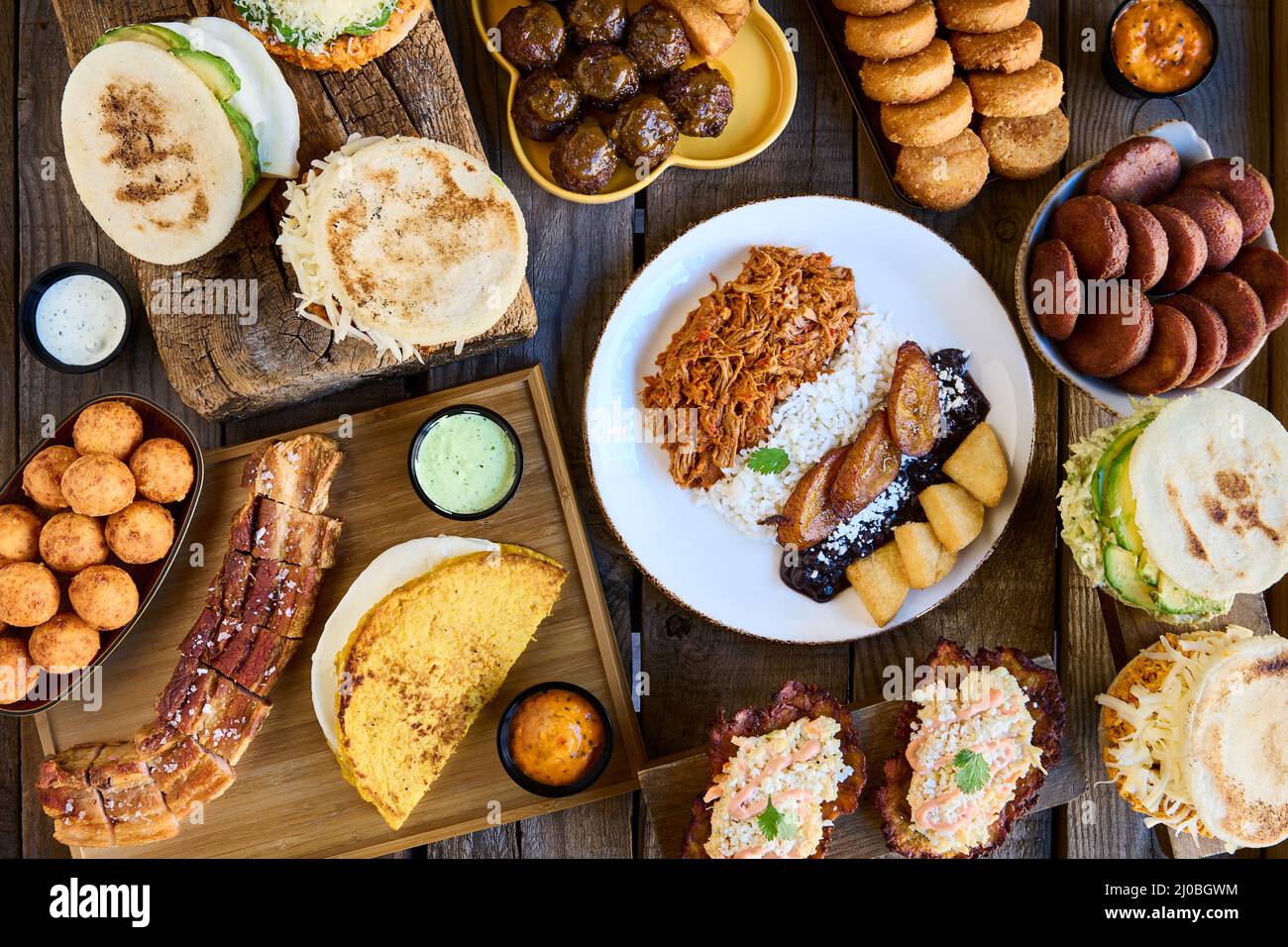 A table full of food with different kinds of meat sandwiches and some ...