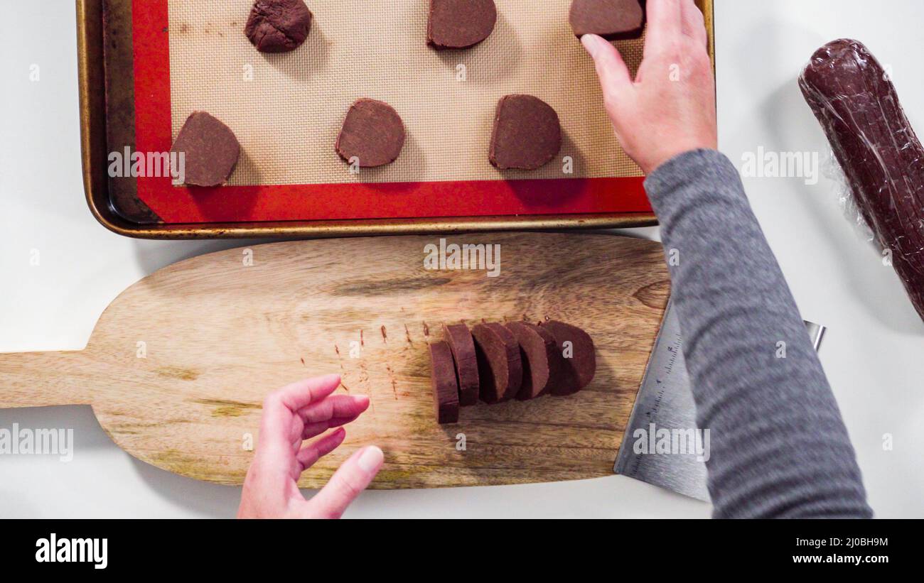 Step by step. Flat lay. Cutting chocolate cookie dough on a wood ...