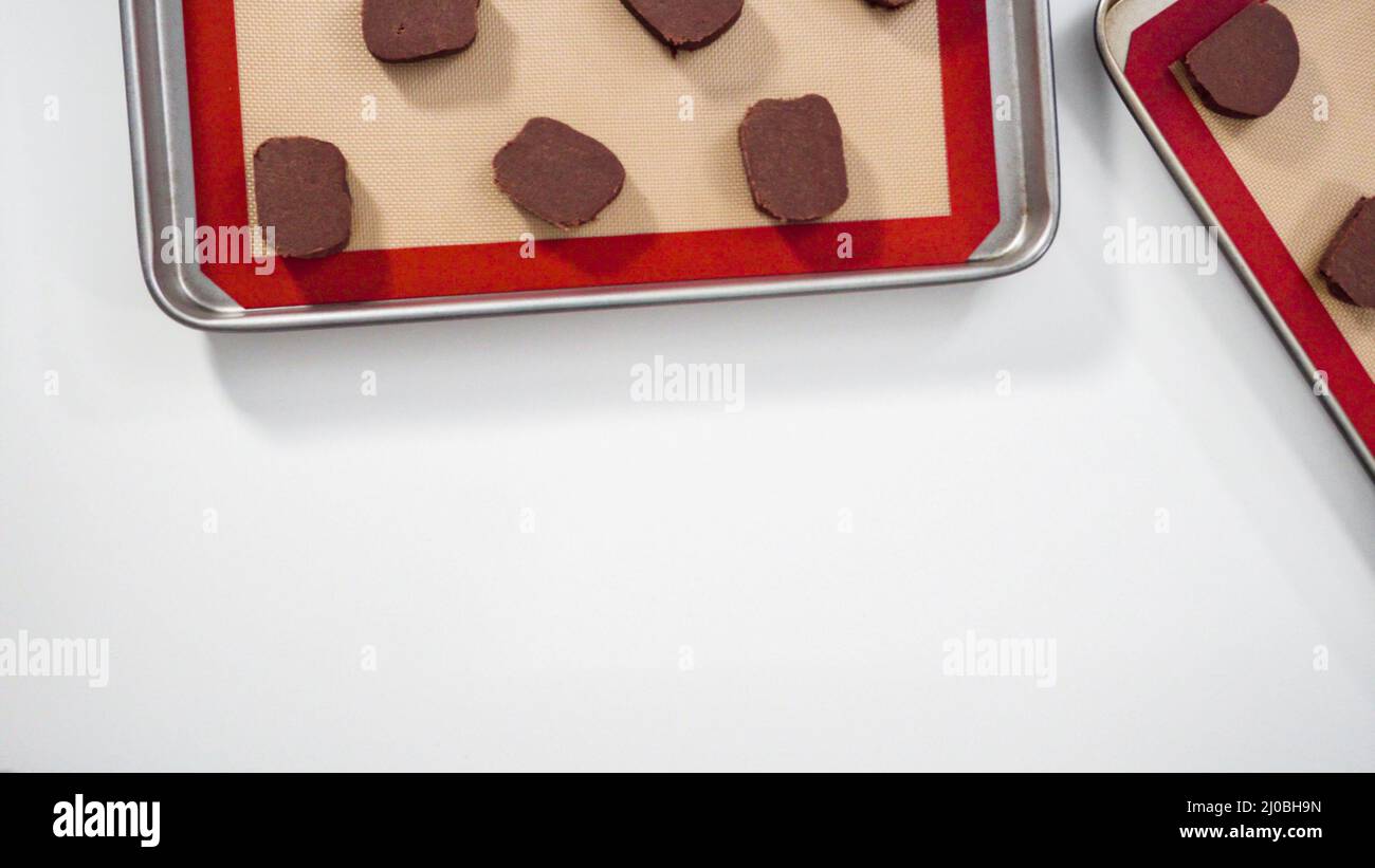 Step by step. Flat lay. Unbaked chocolate cookies on a baking sheet ...