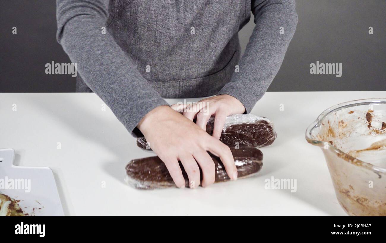 Step by step. Wrapping cookie dough into the plastic wrap to bake ...