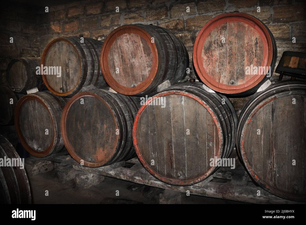 Lying barrels of wine in a cellar Stock Photo - Alamy