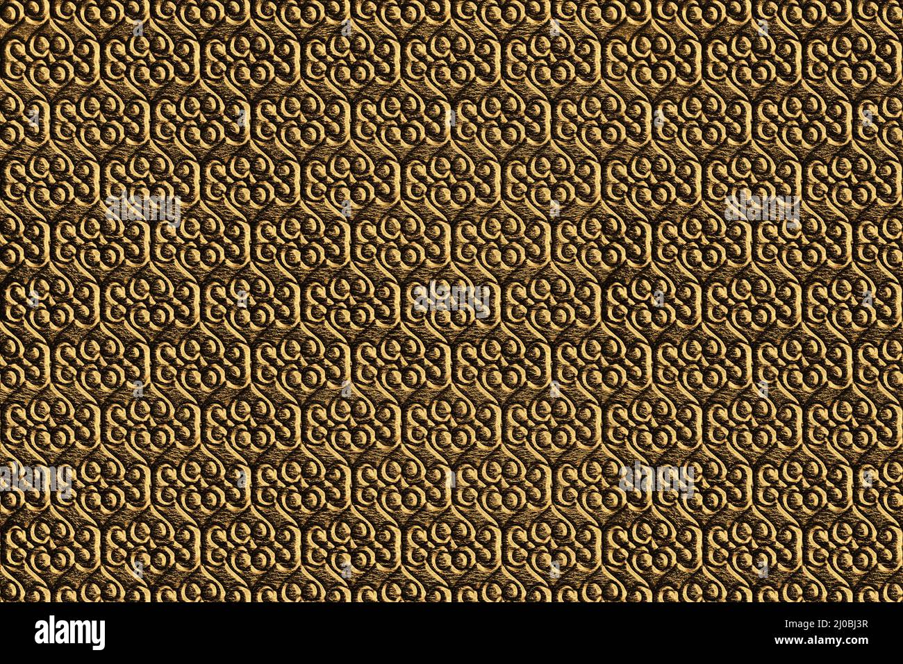 Background with gold embossed pattern on leather texture Stock Photo ...