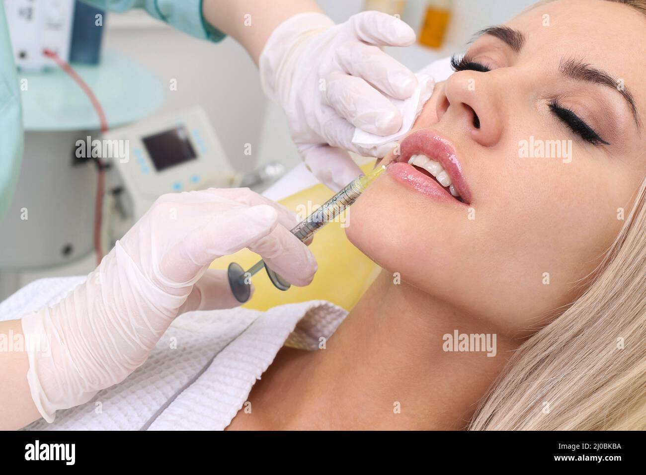 Injection in her lips Stock Photo - Alamy
