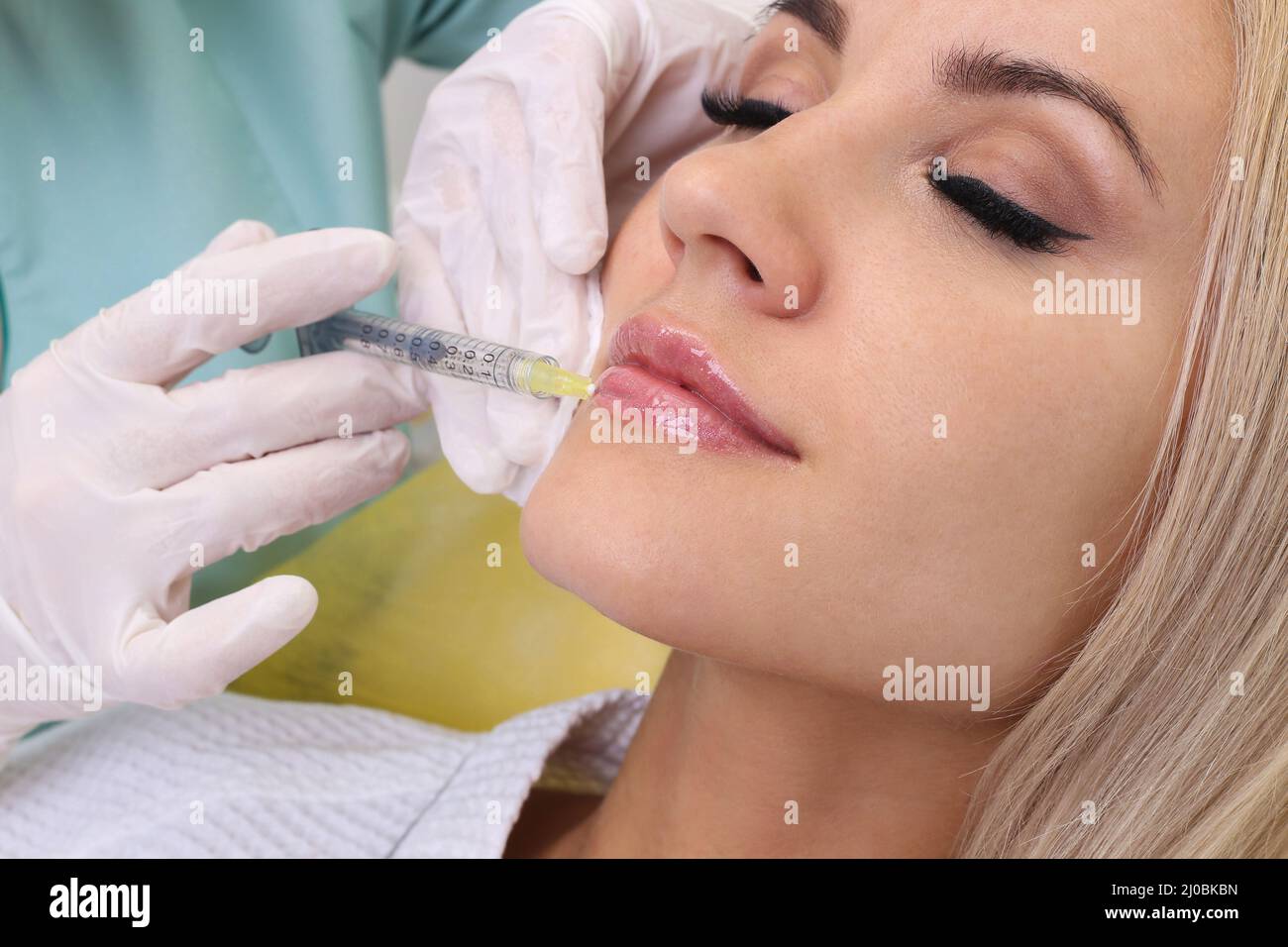 Injection in her lips Stock Photo - Alamy